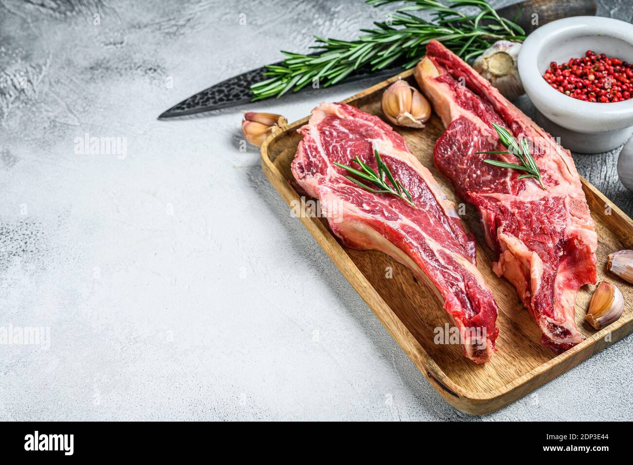 Raw cuts of beef marble meat on the bone. White background. Top view ...