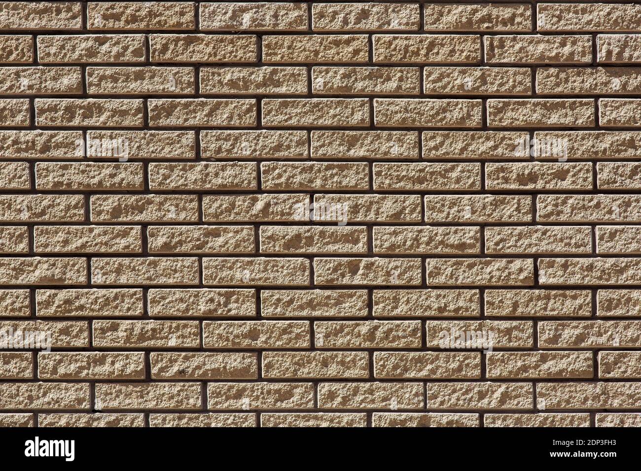 brick facade of beige wall, stone building texture, closeup nobody ...