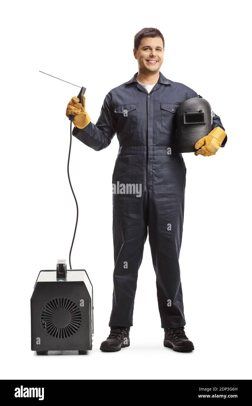 Full length portrait of a welder in a uniform with a welding generator ...