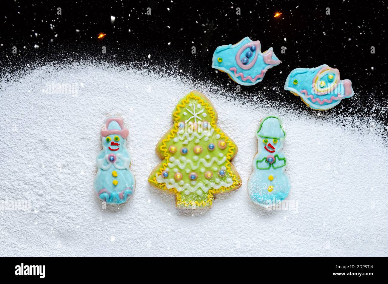 Christmas scene with different gingerbread and snow overlay, top view ...