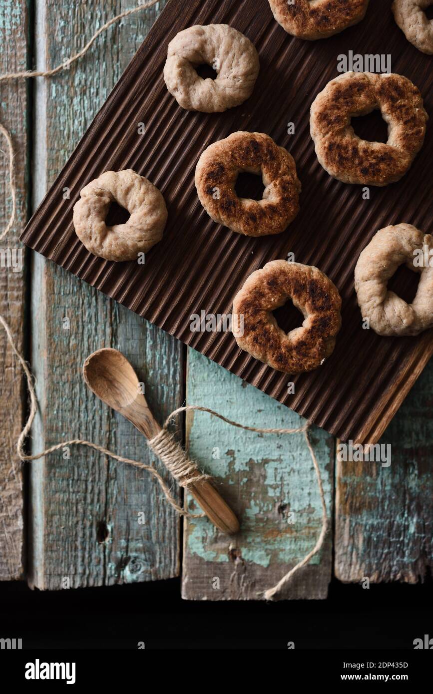 Homemade hygge pastry. Small Scandinavian cookies or kringles on oak ...