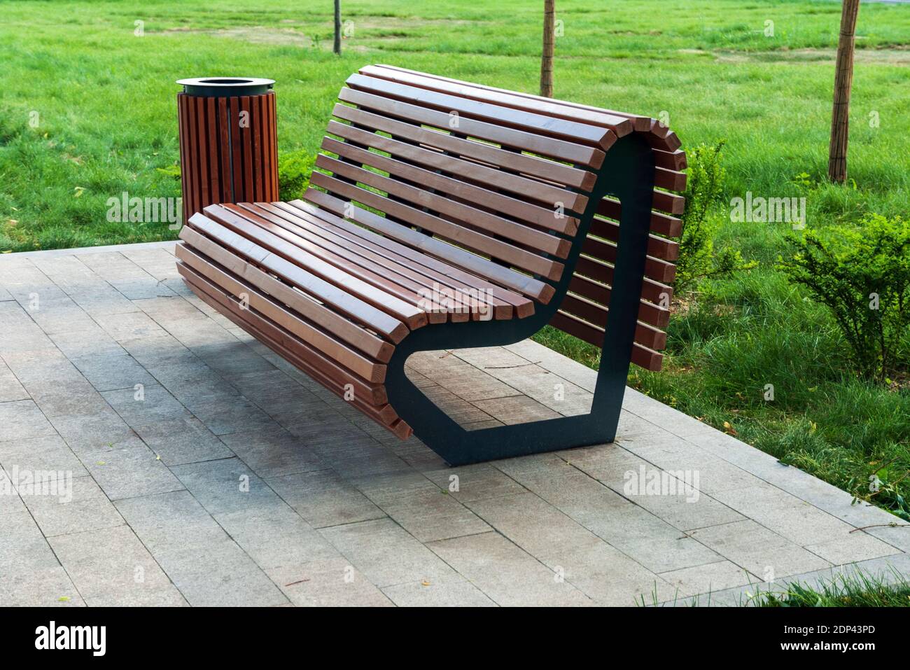 modern park bench and waste bin made of wooden planks Stock Photo - Alamy