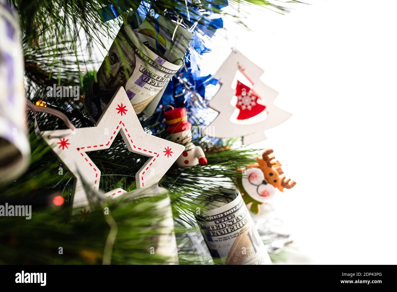 Christmas tree of wealth, with American money bills and wishes of ...