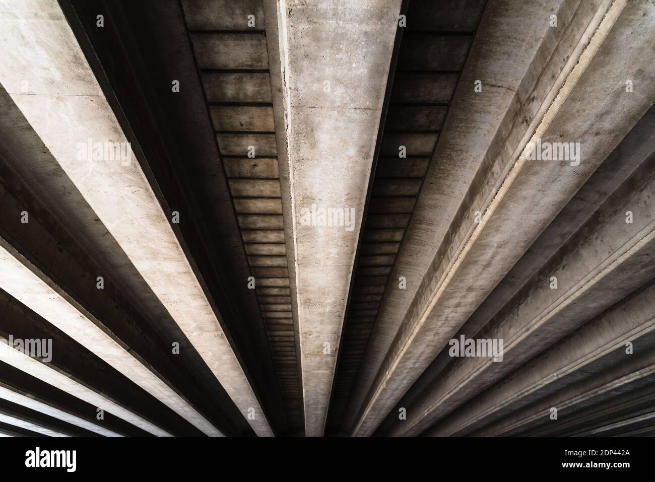 Cement beams support the weight of a bridge over a road Stock Photo - Alamy
