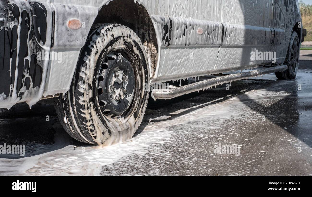 Car wash, lorry covered with foam in cleaner Stock Photo - Alamy