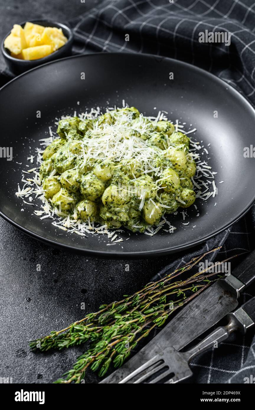 Gnocchi with basil spinach sauce and Parmesan. Italian potato paste ...