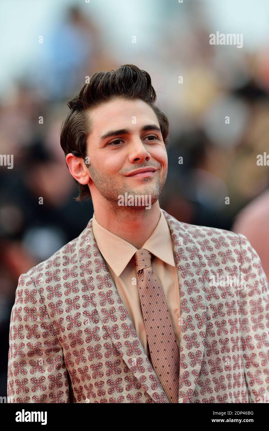 Xavier Dolan arriving at the Palais des Festivals for the screening of ...