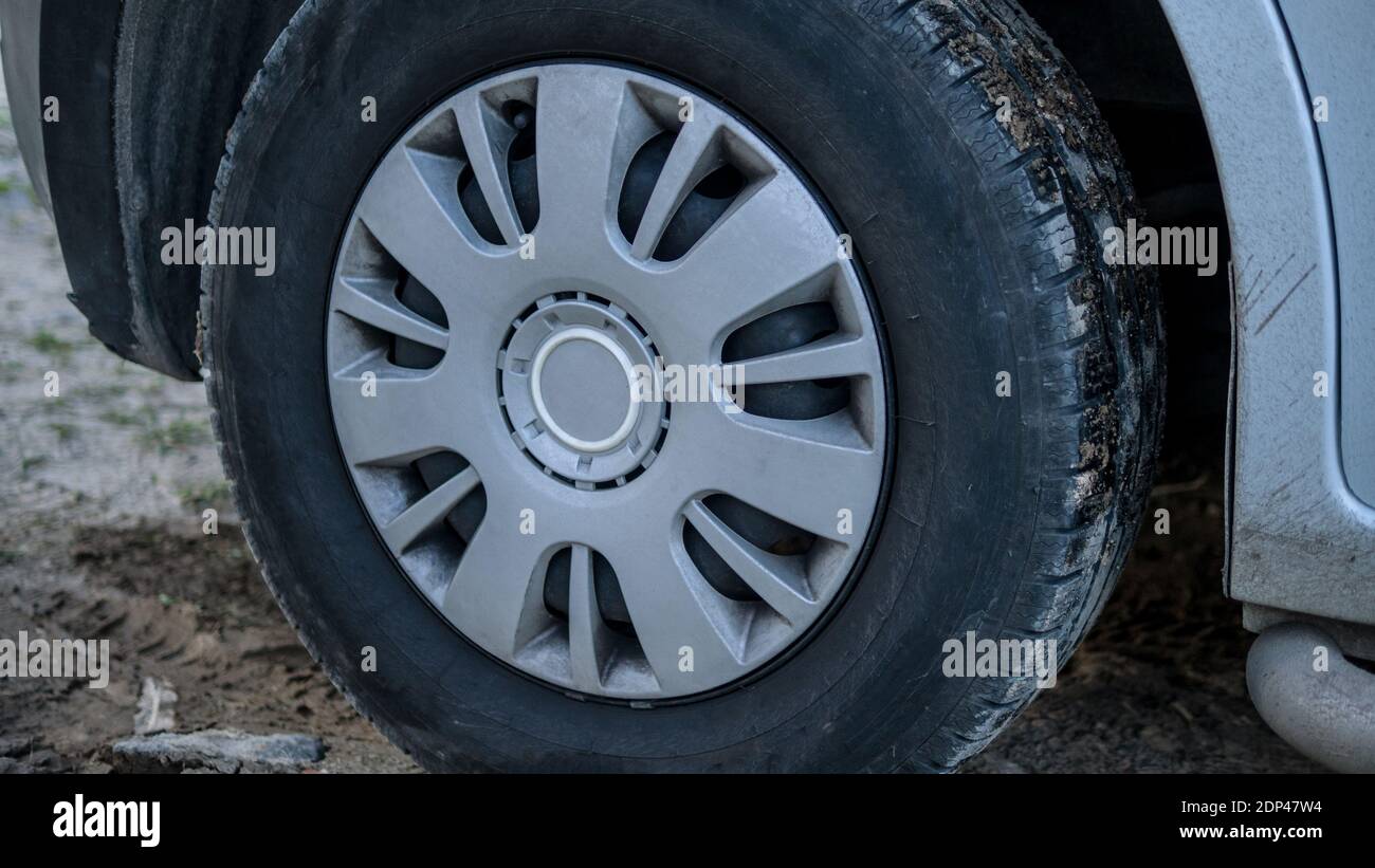 Wheel of a car parked in a swamp Stock Photo - Alamy