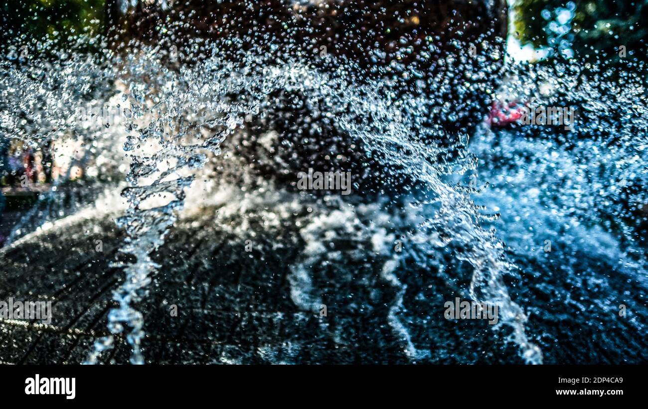 Beautiful spray of water on a black background,drops splash,black ...