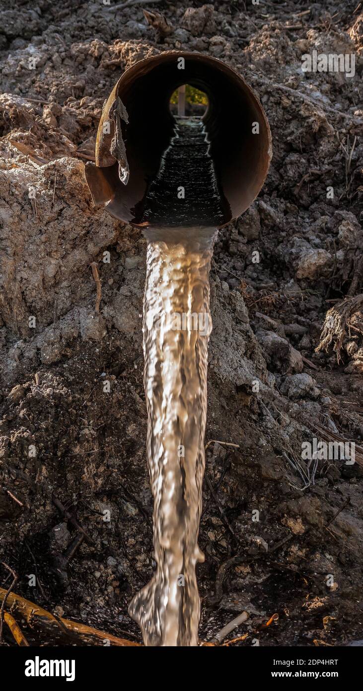 Waste water flows from the pipe,pollution of nature and the environment ...