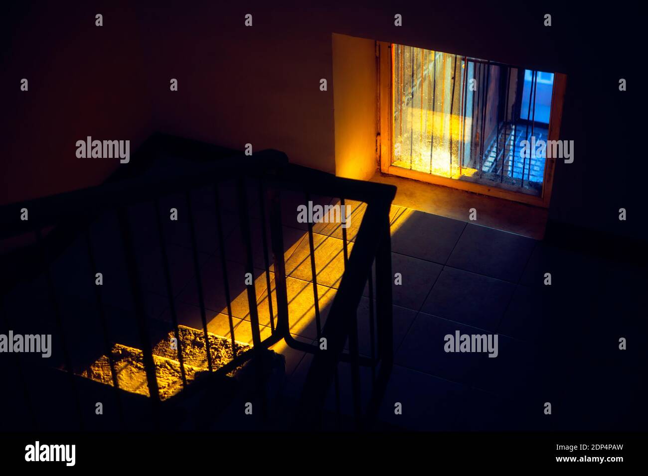 Dark corridor with stairs in dim light . Dark interior with Sunlight in ...