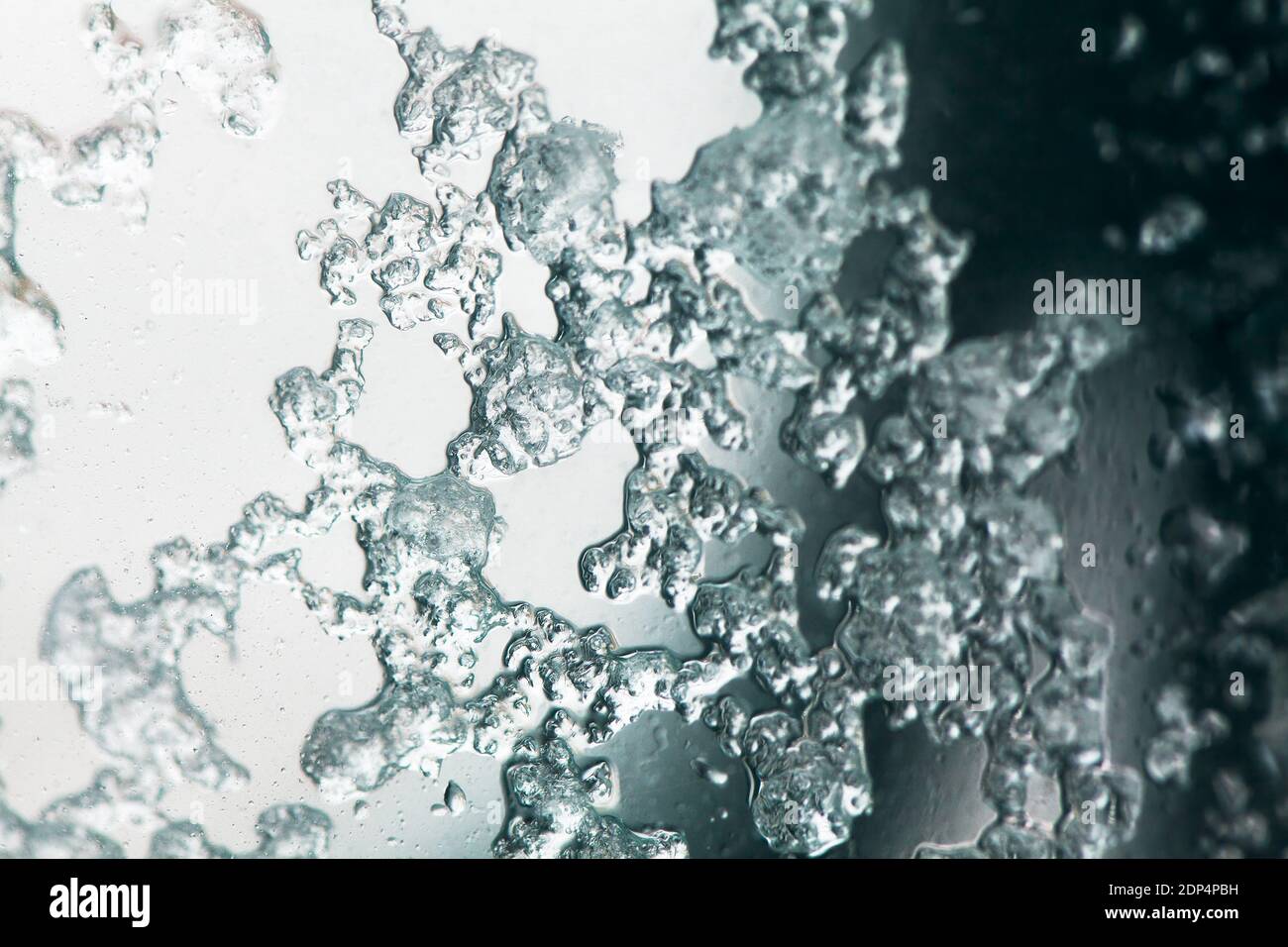 Melting ice on the window glass . Winter weather data Stock Photo - Alamy