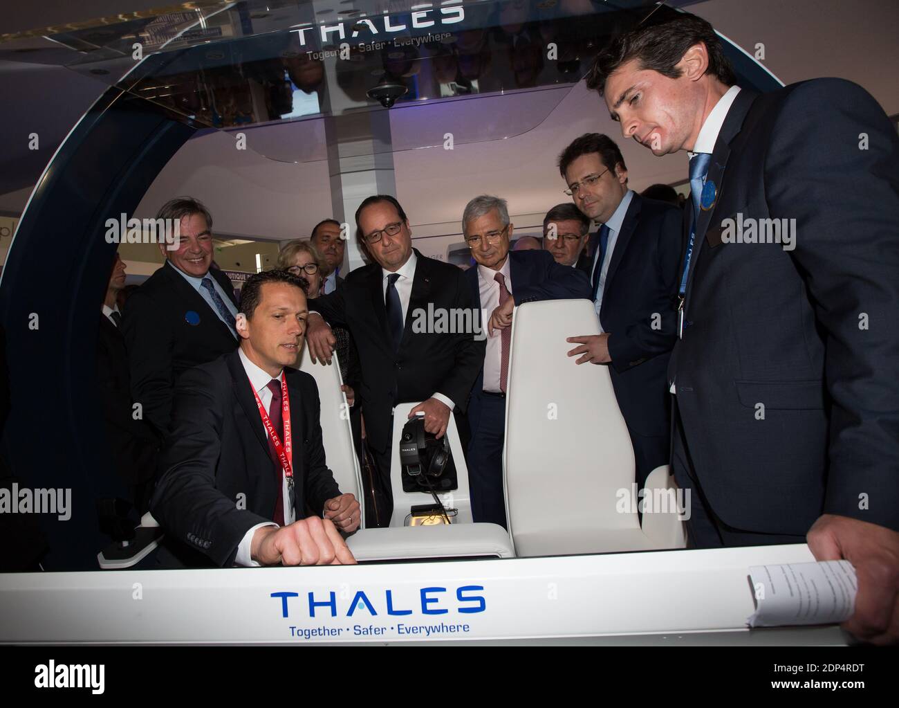 French President Francois Hollande (C) listens to Thales CEO Patrice ...