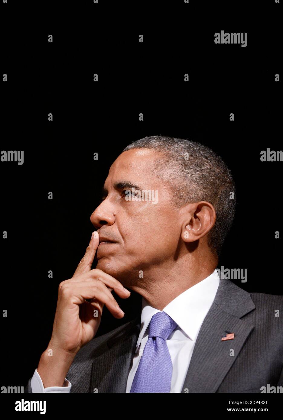 President Barack Obama looks on during an investiture ceremony for ...