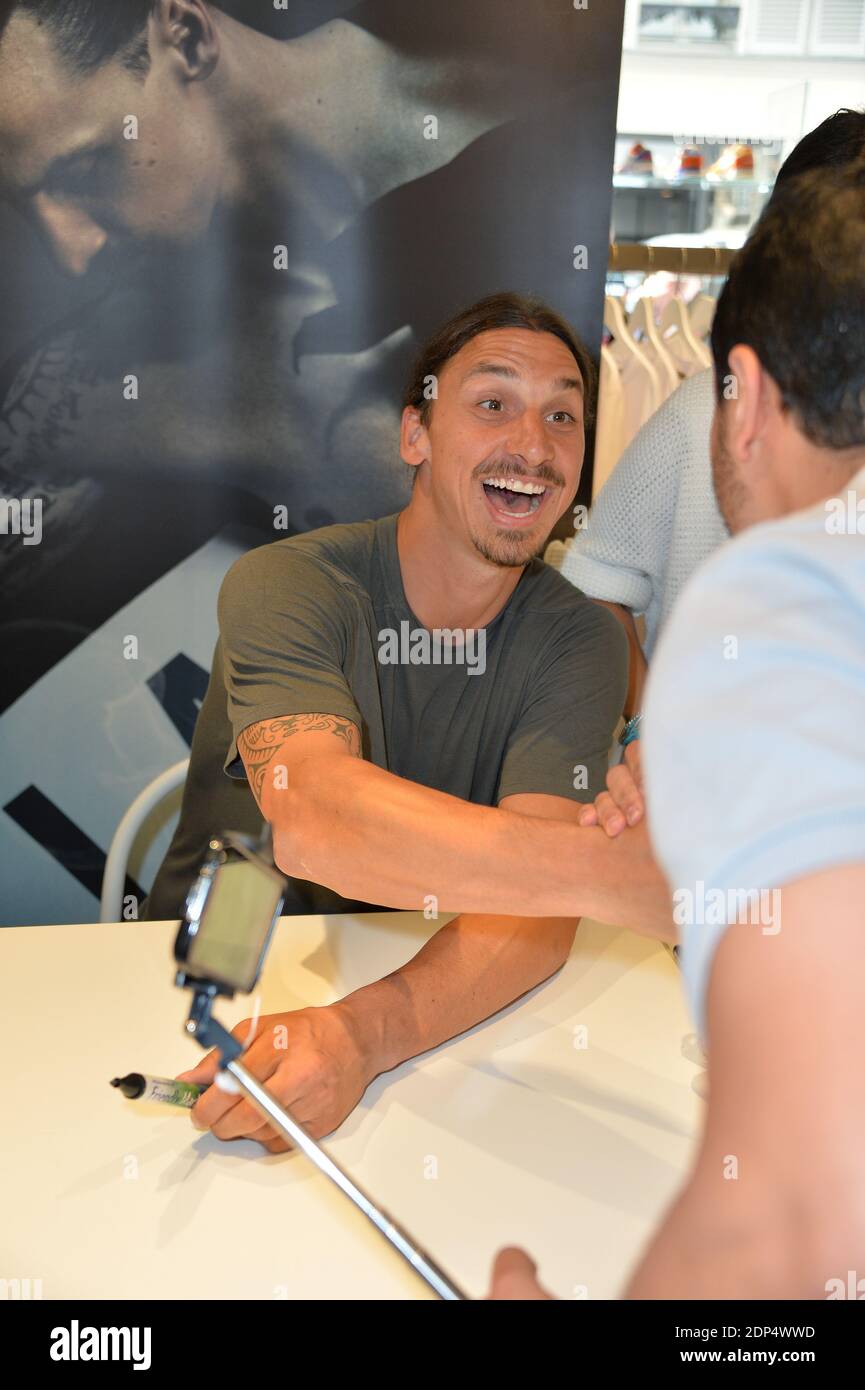 Zlatan Ibrahimovic signs autographs for his fan at Colette store for ...