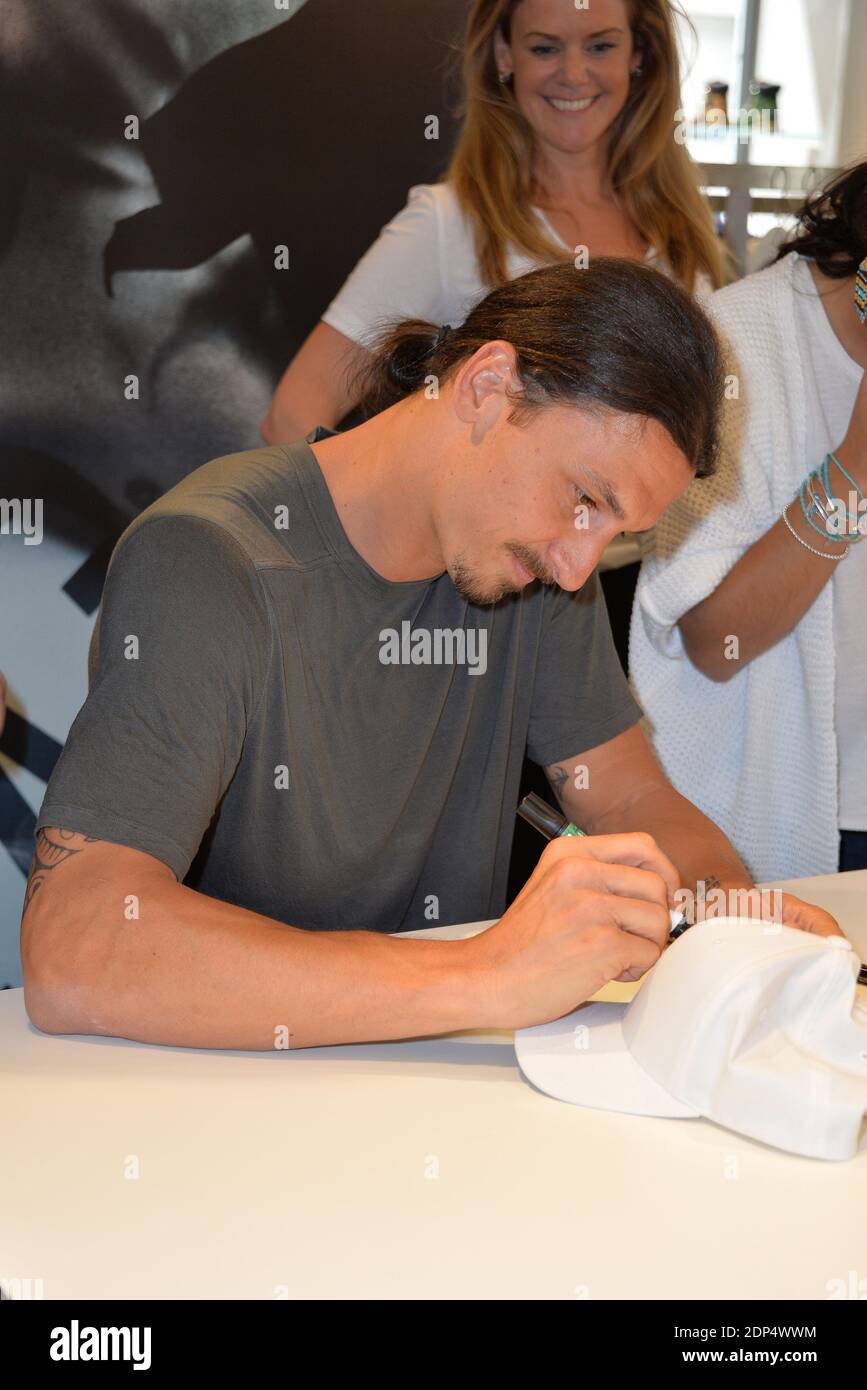 Zlatan Ibrahimovic signs autographs for his fan at Colette store for ...