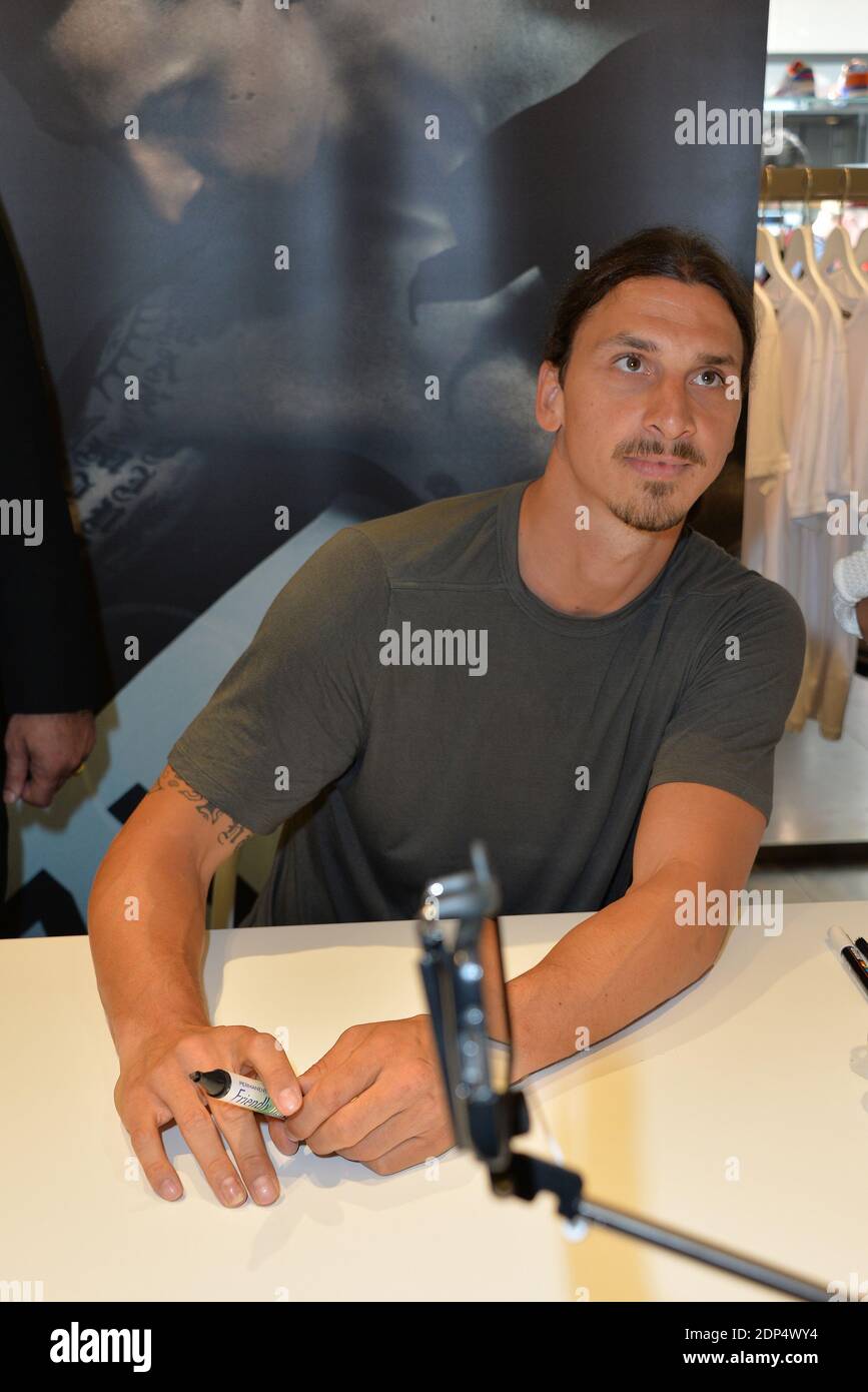 Zlatan Ibrahimovic signs autographs for his fan at Colette store for ...