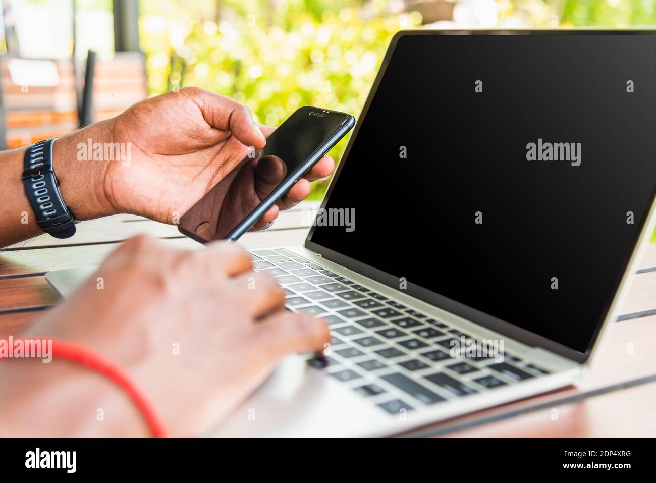 Happy Asian hand black man person working with laptop computer and ...