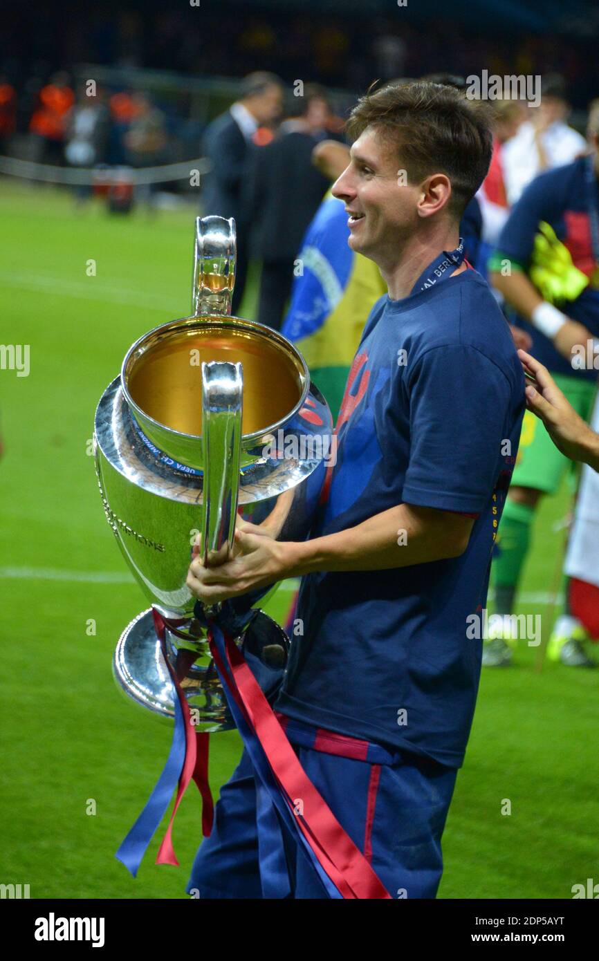 Barcelona's Lionel Messi receiving the Champions League Cup after the ...