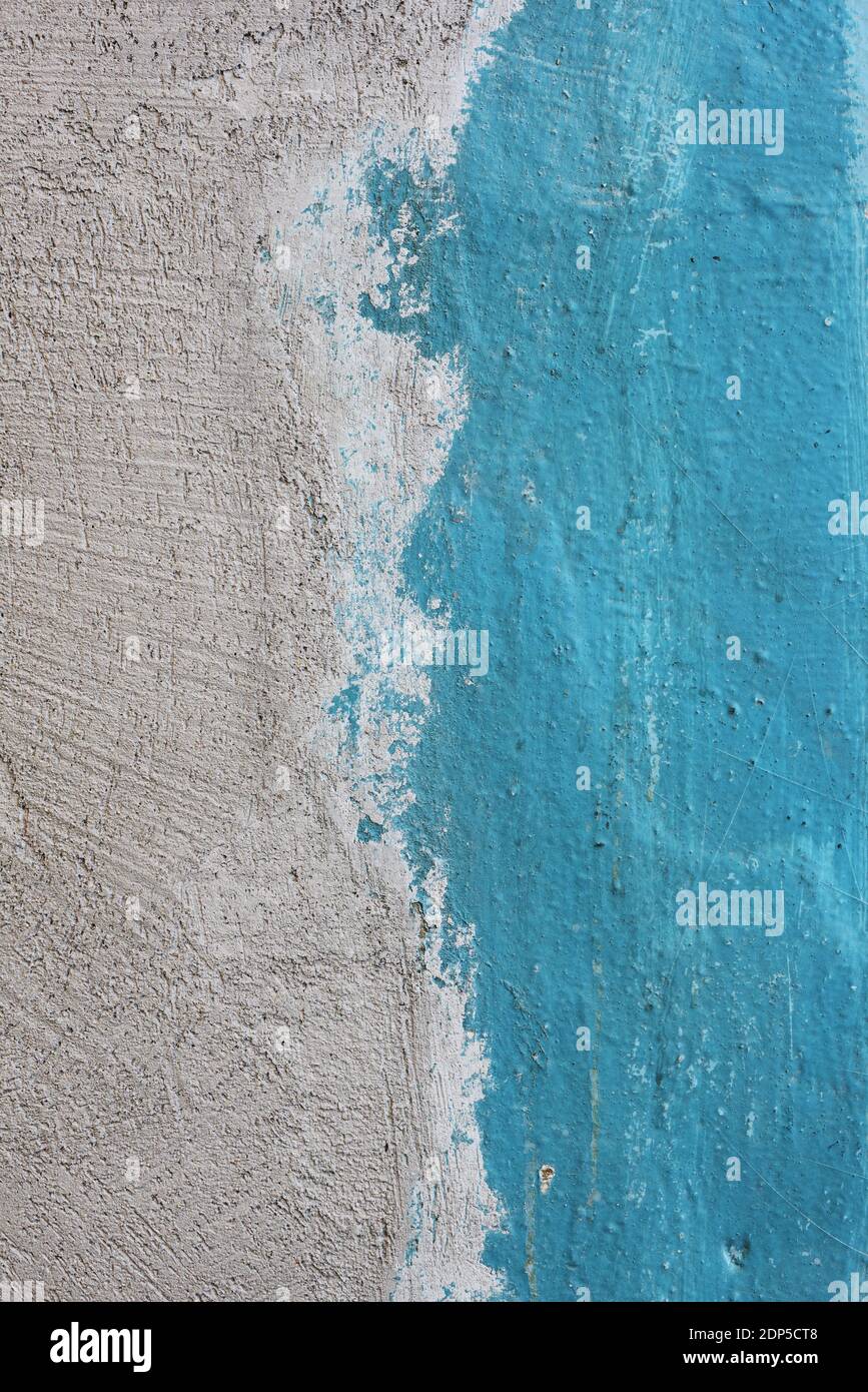 Coarse plaster texture painted blue resembling sea shore as wall ...