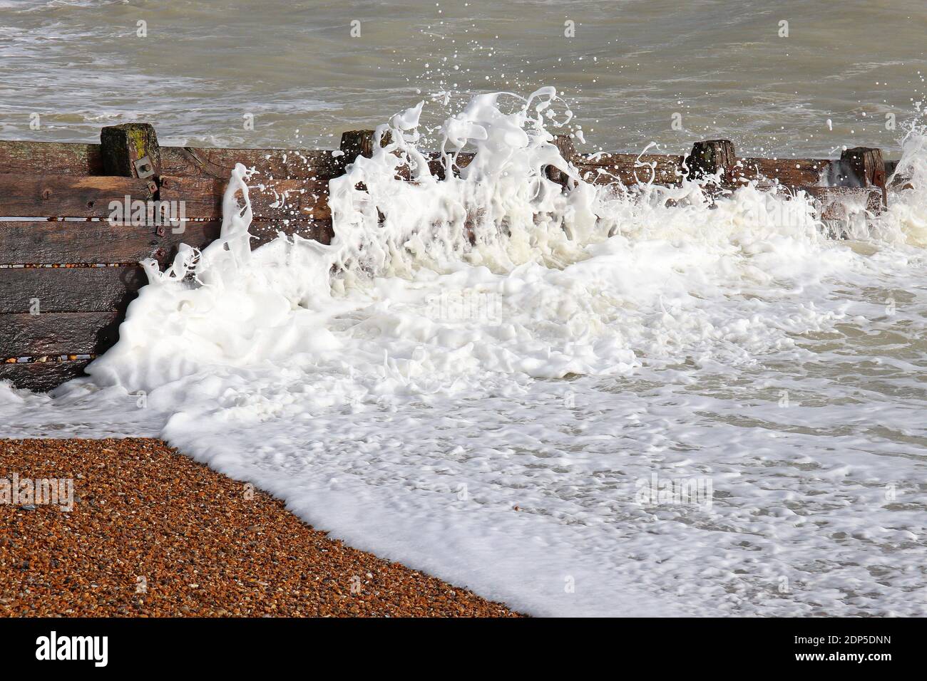 Old weathered groynes protecting the beach at Pevensey Bay on the south ...