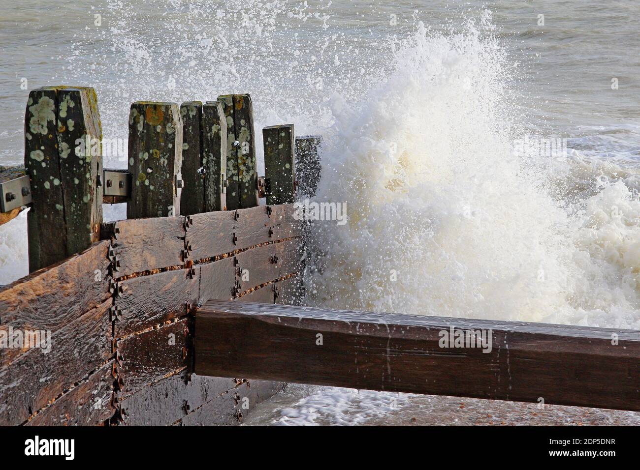 Old weathered groynes protecting the beach at Pevensey Bay on the south ...