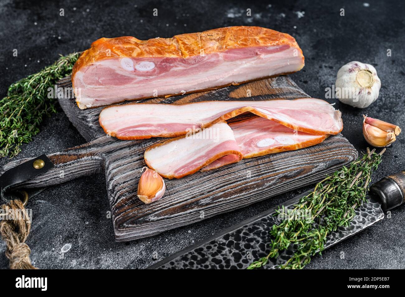 Smoked pork belly bacon block. Black background. Top view Stock Photo ...