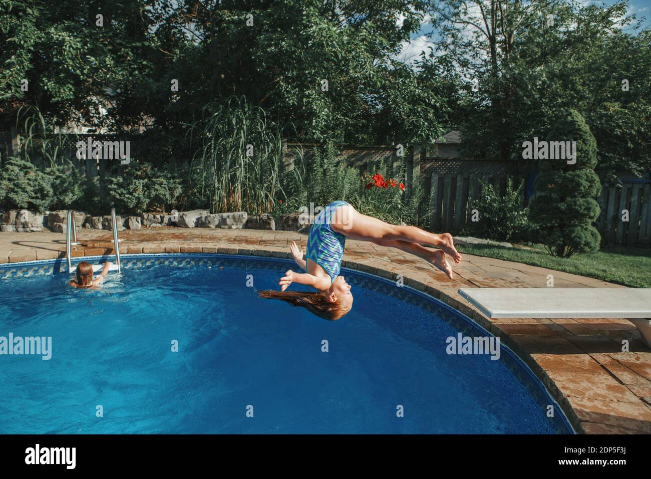 Diving girl in swimsuit hi-res stock photography and images - Alamy