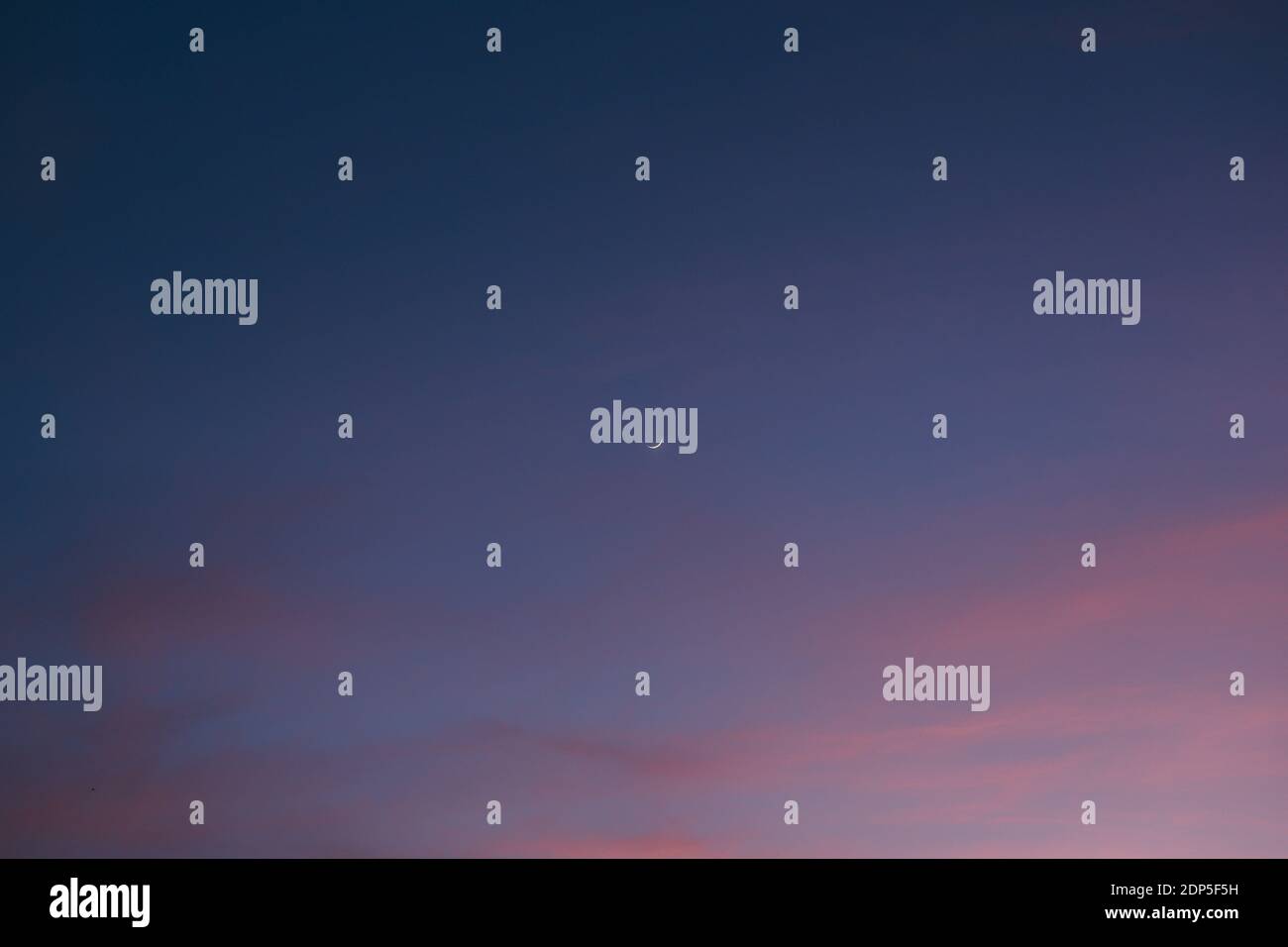Dawn pastel sky with minimal crescent moon Stock Photo - Alamy