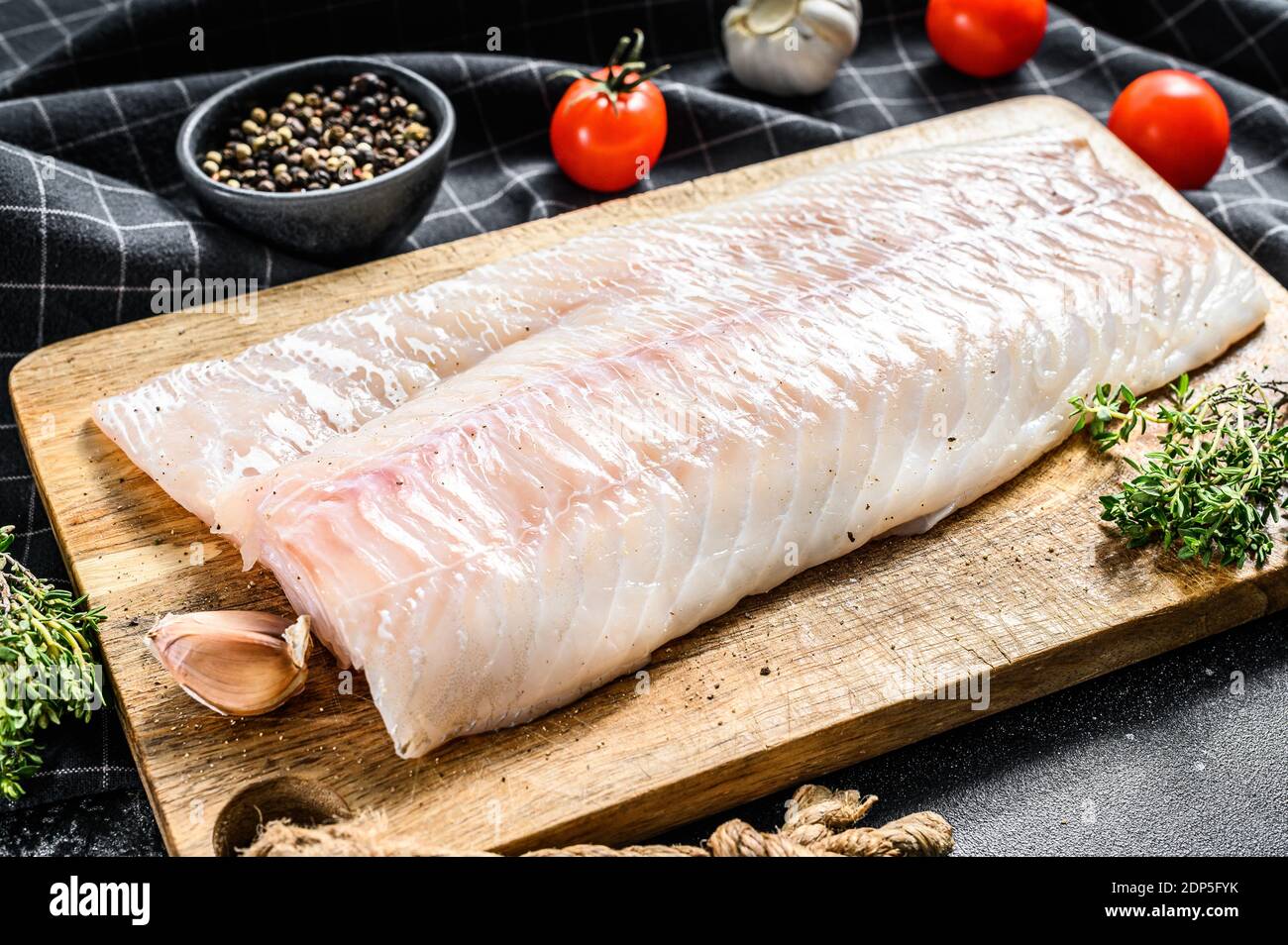 Fresh Raw Cod loin fillet with thyme. Black background. Top view Stock ...