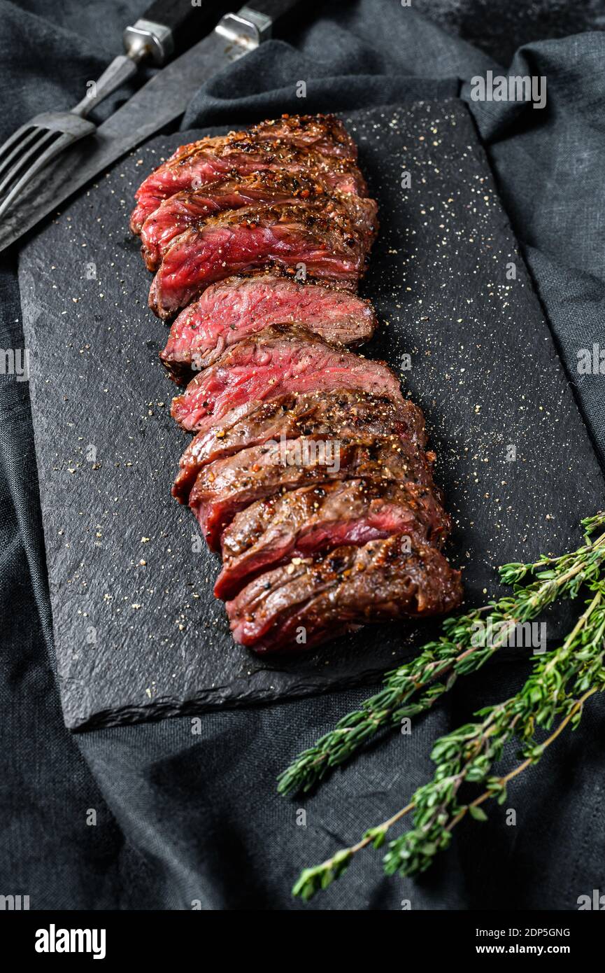 Grilled roasting rare sliced top blade, Denver steak. Marble meat beef ...
