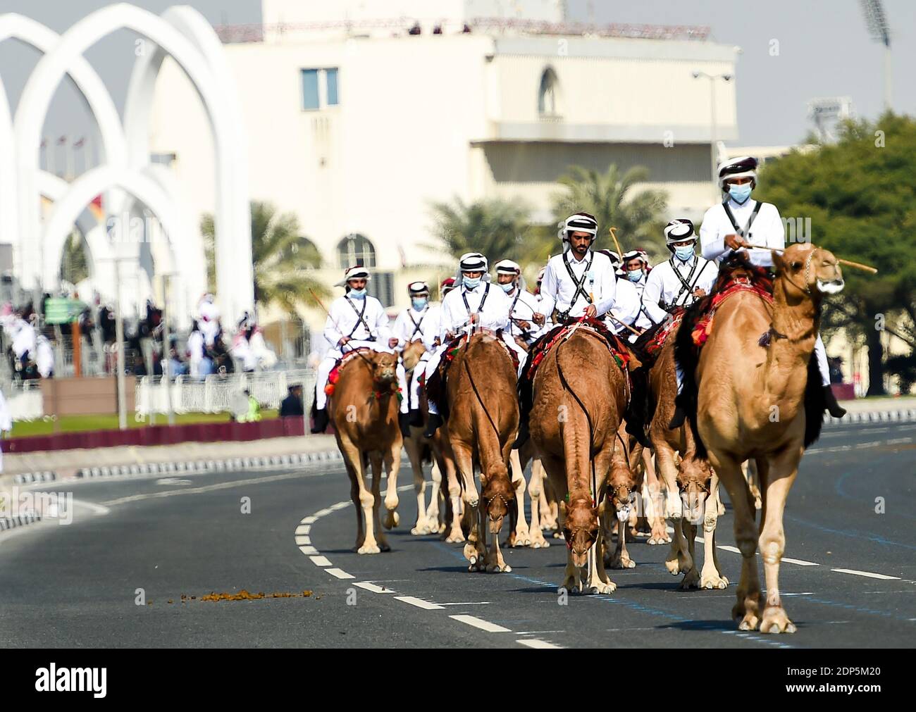 Doha, Qatar. 18th Dec, 2020. Qatari Heritage Police riding camels take ...