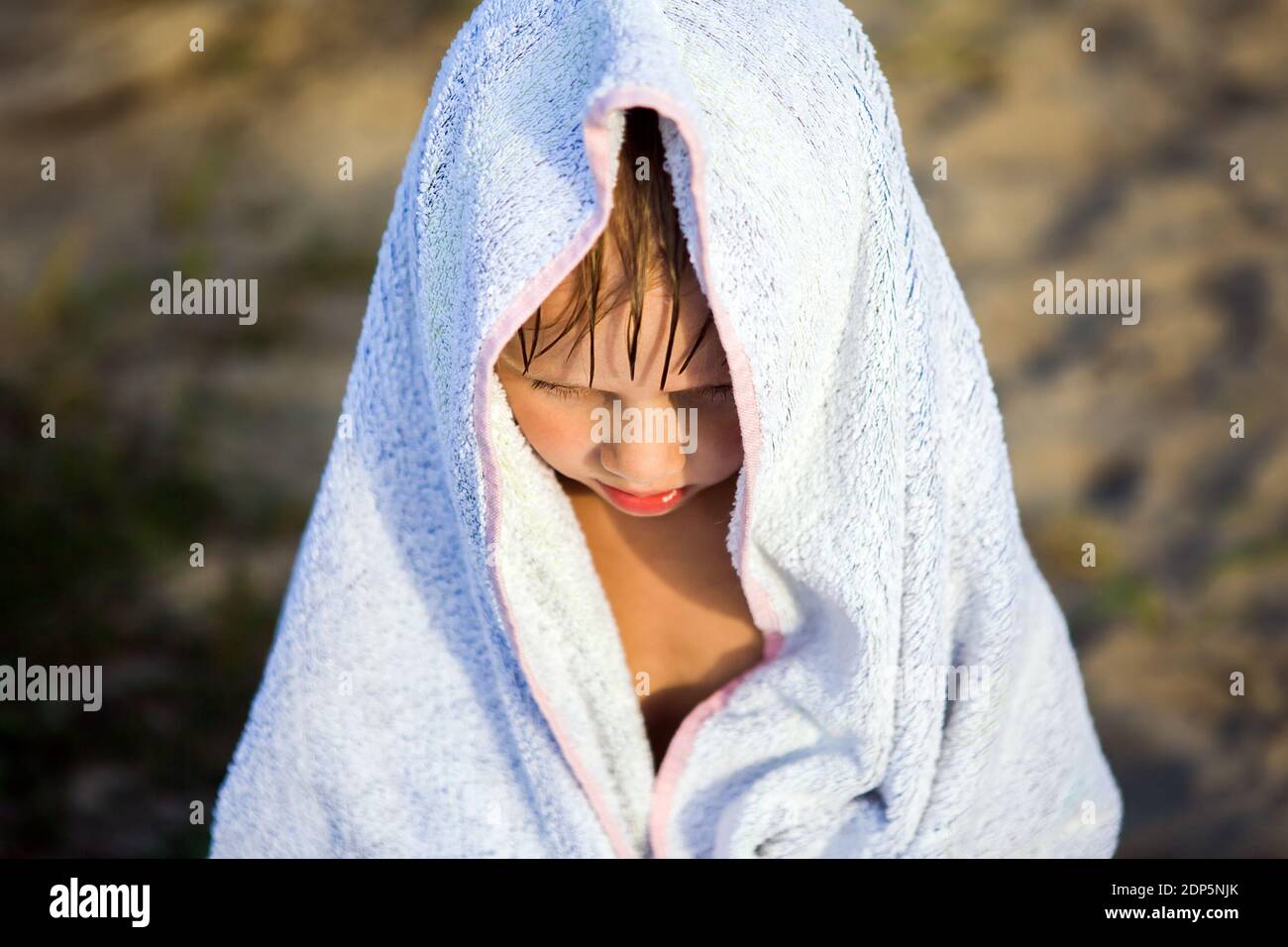 Sad Kid in the Bath Towel on the Summer Beach Portrait closeup Stock ...