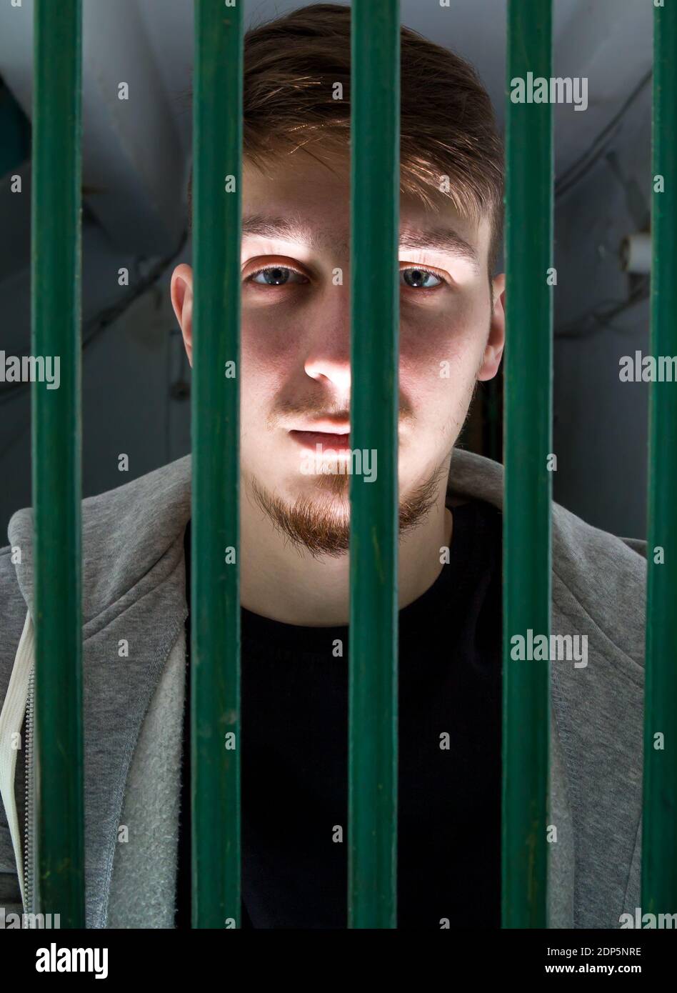 Man behind bars hi-res stock photography and images - Alamy