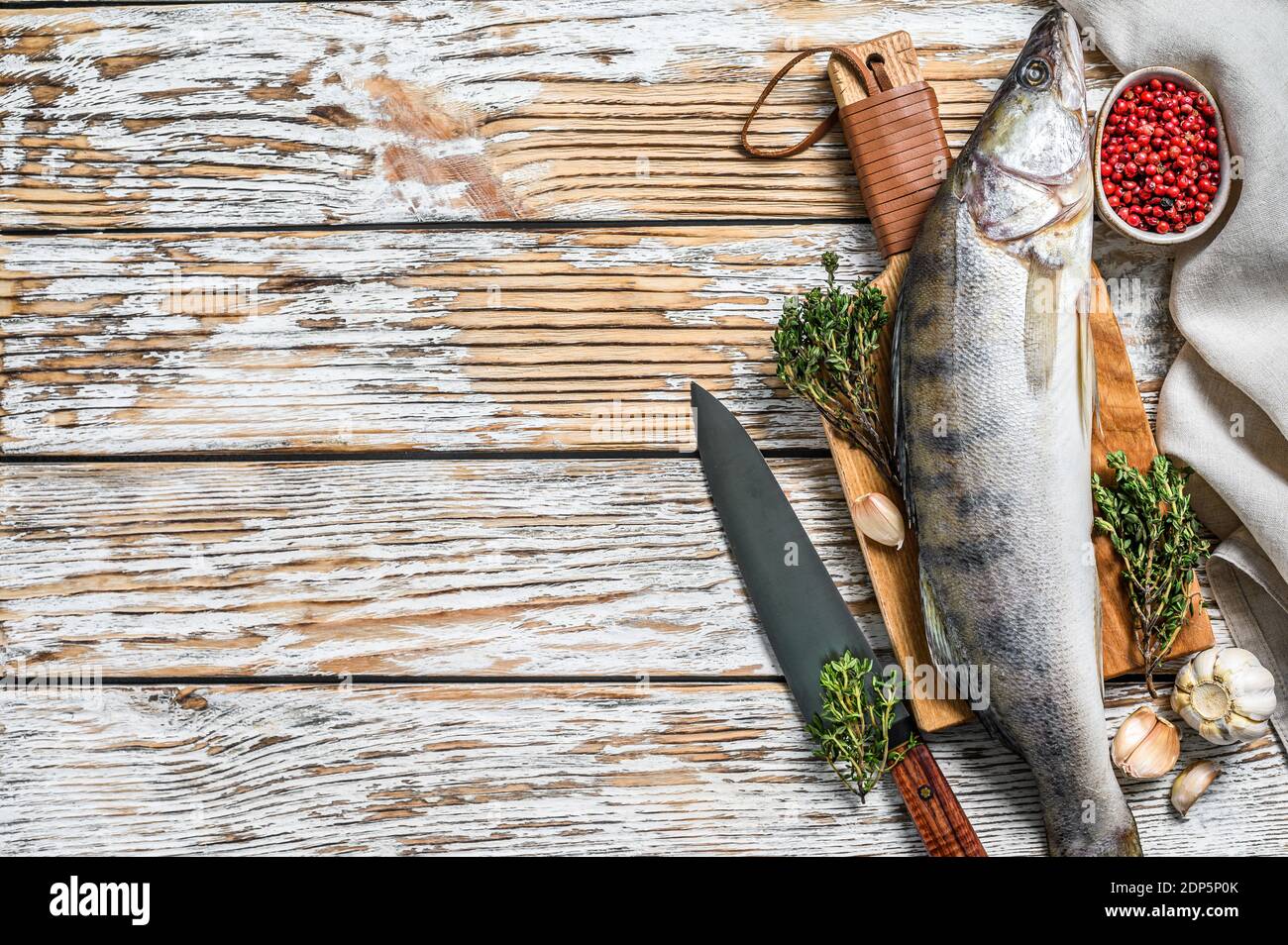 Raw pike perch, pikeperch fish on a cutting board. Fresh fish. White ...