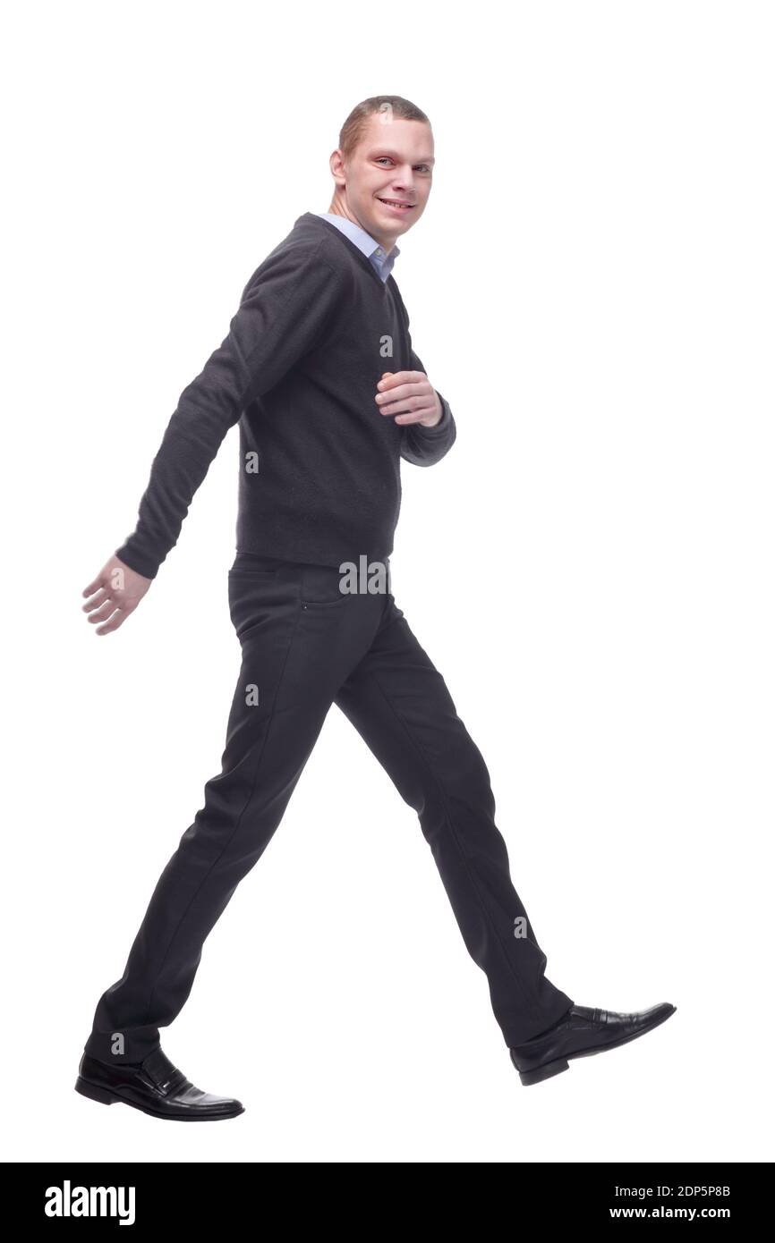 Picture of a young business man walking forward - side view Stock Photo ...