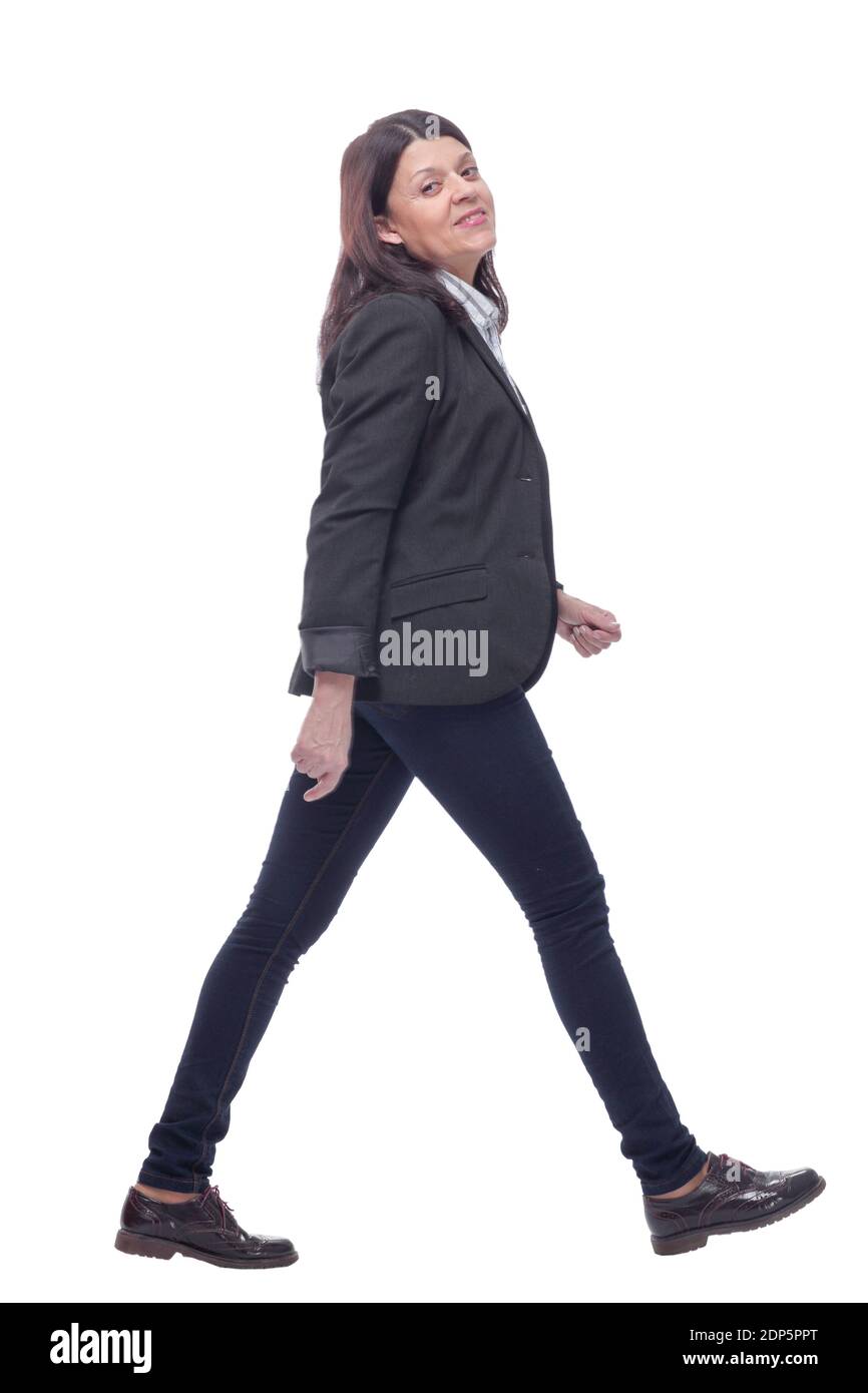 Side view of a casual woman walking and looking forward Stock Photo - Alamy