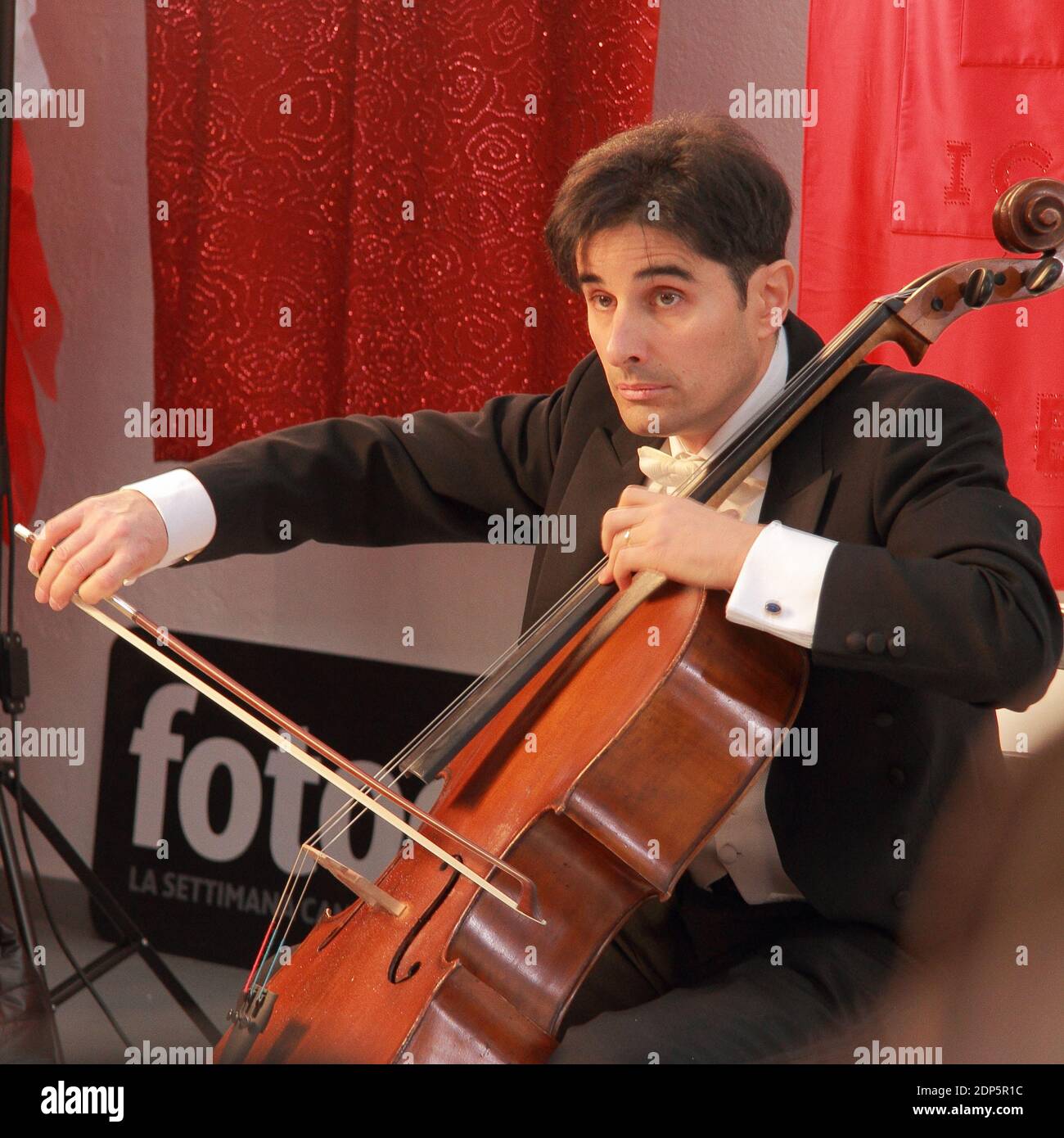 Musician playing with his instrument Stock Photo - Alamy