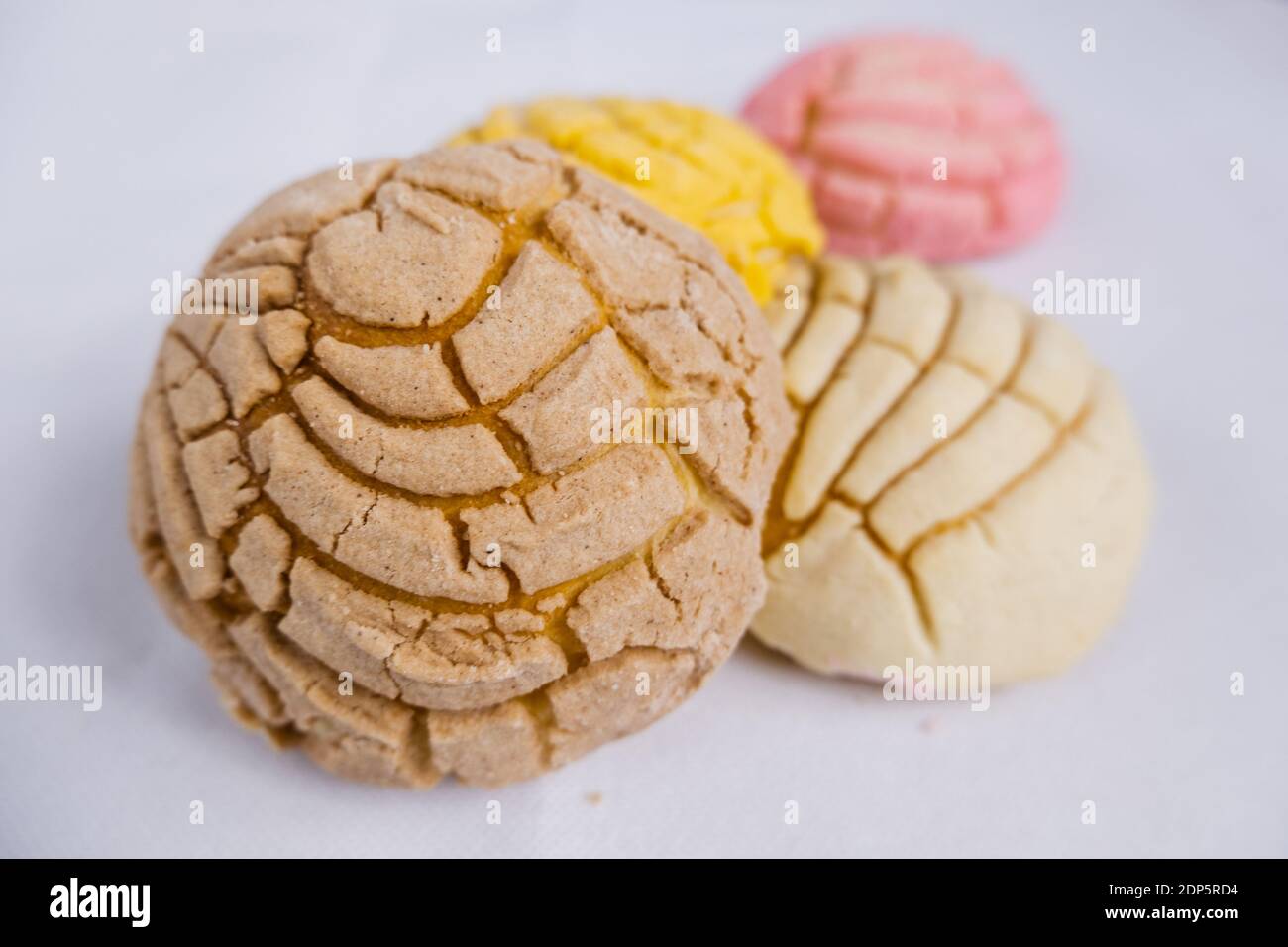 Colorful Mexican sweet bread on a white table Stock Photo - Alamy