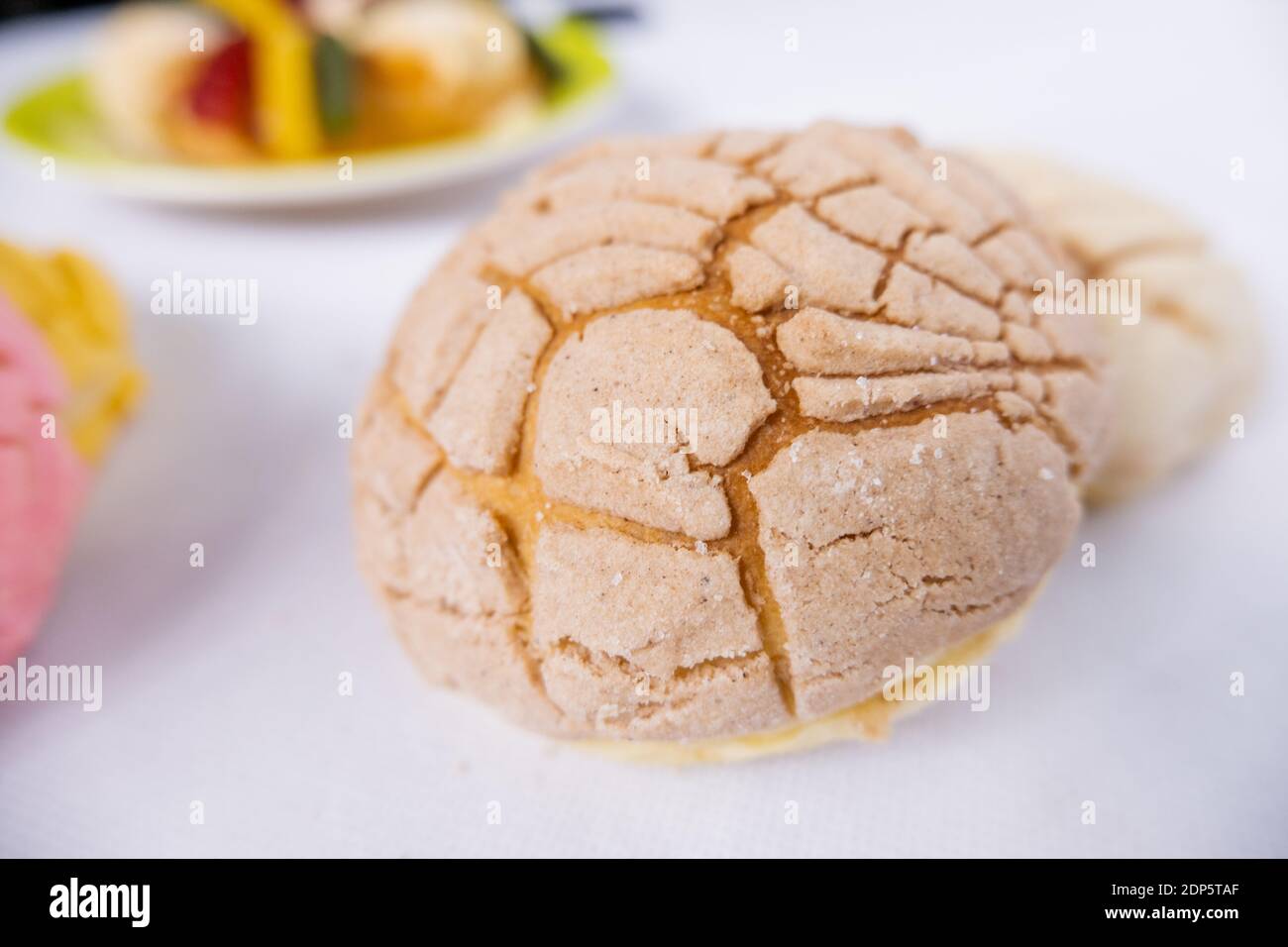 Colorful Mexican sweet bread on a white table Stock Photo - Alamy