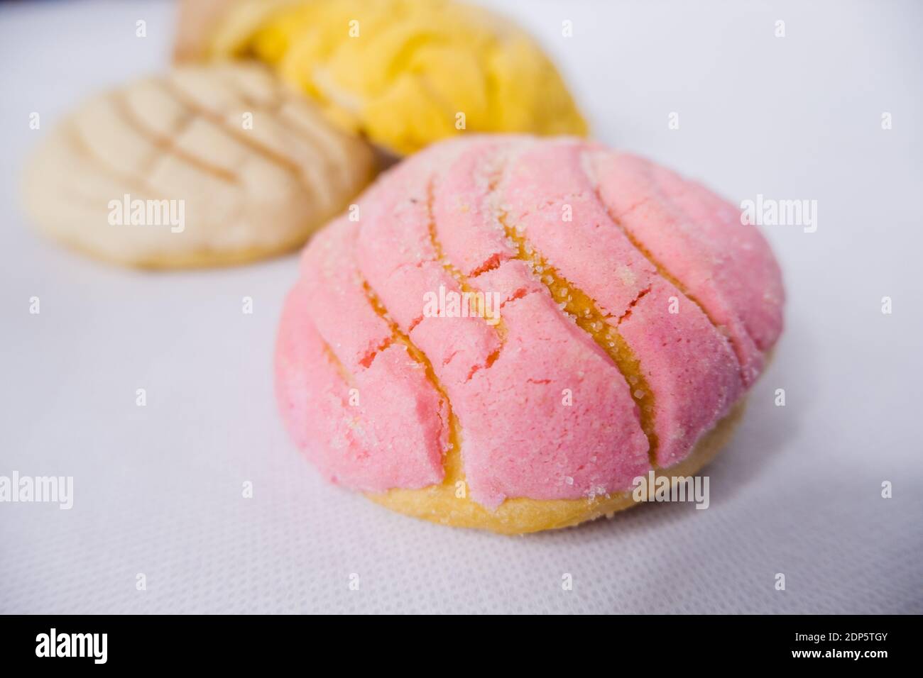 Colorful Mexican sweet bread on a white table Stock Photo - Alamy