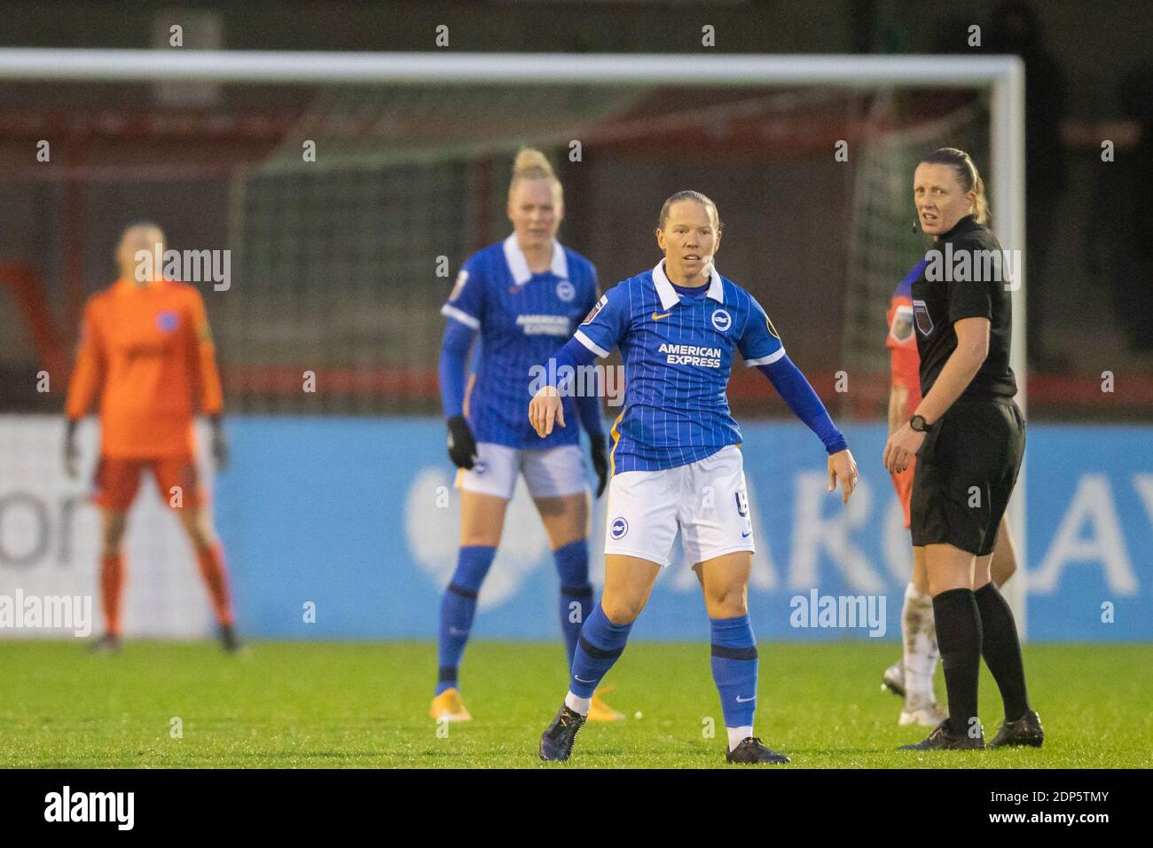 Danielle Bowman #4 of Brighton & Lisa Benn (Referee) looking up the ...
