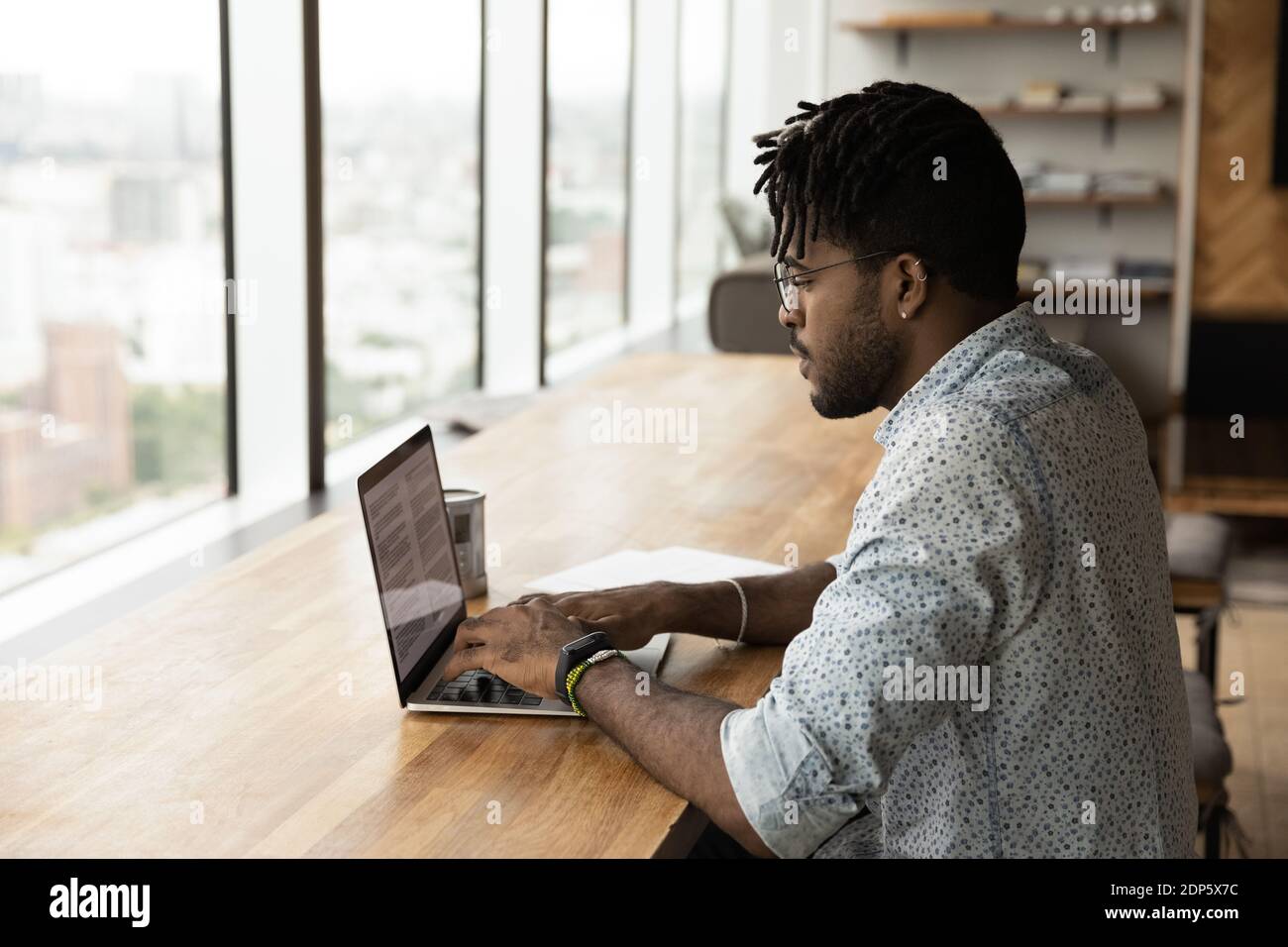Millennial biracial man work online on computer at home Stock Photo - Alamy