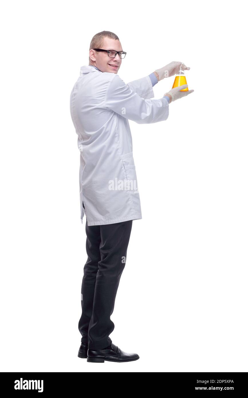 Chemist holding up beaker of yellow chemical in the laboratory Stock ...