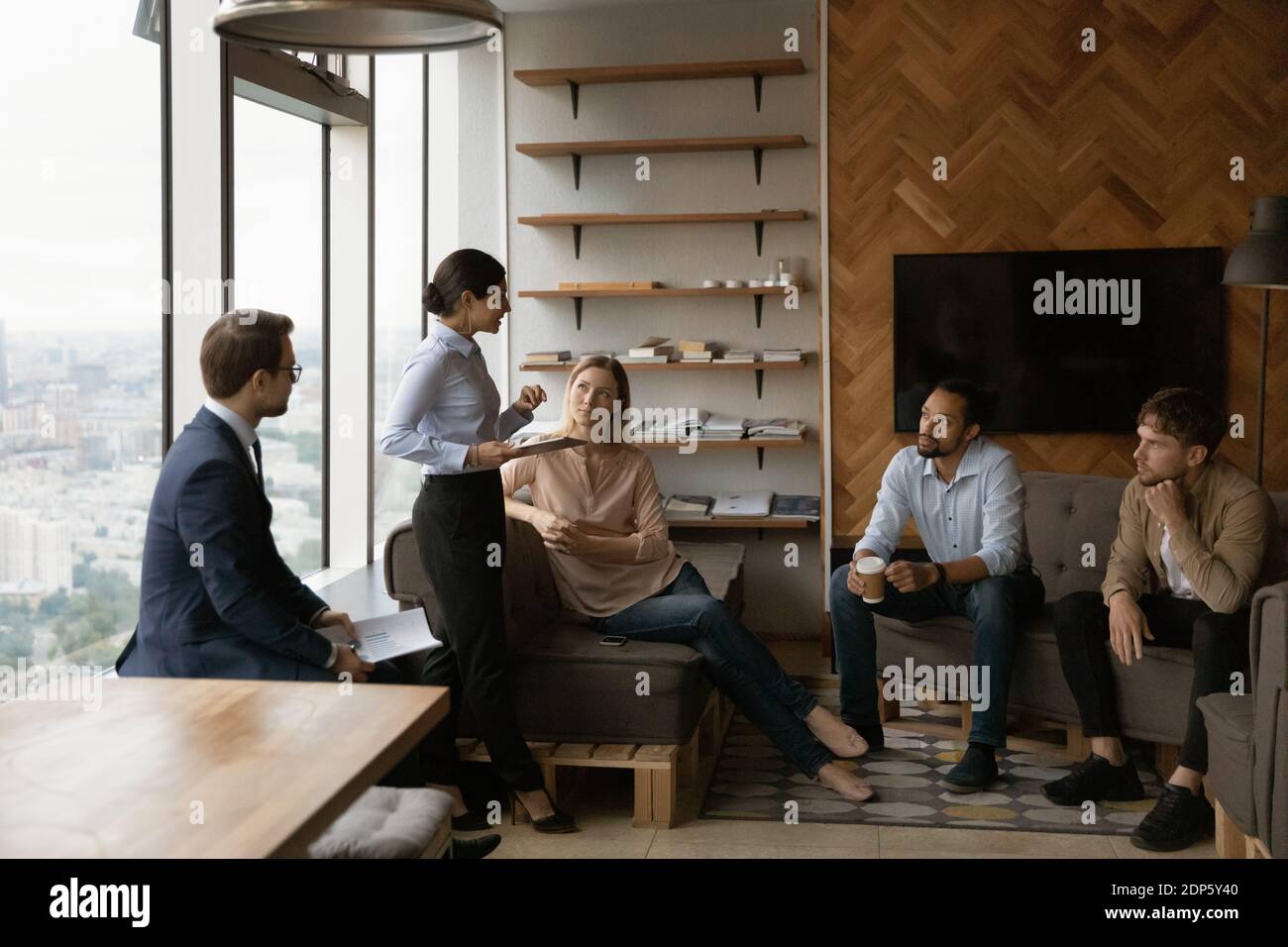 Diverse colleagues cooperate at team meeting in office Stock Photo - Alamy