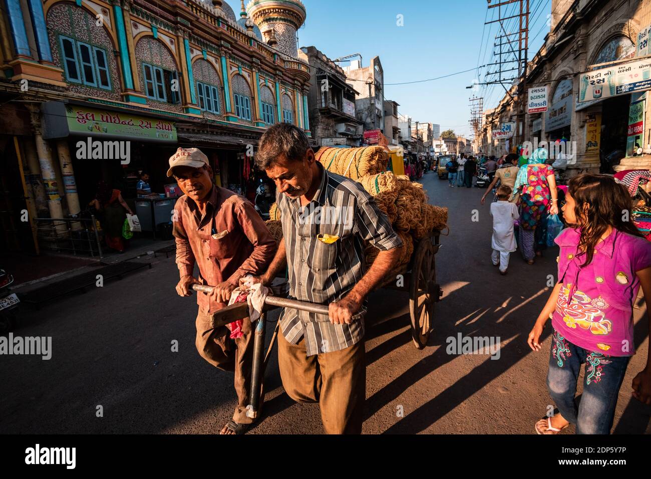 Jamnagar, Gujarat, India - December 2018: Indian labourers transporting ...