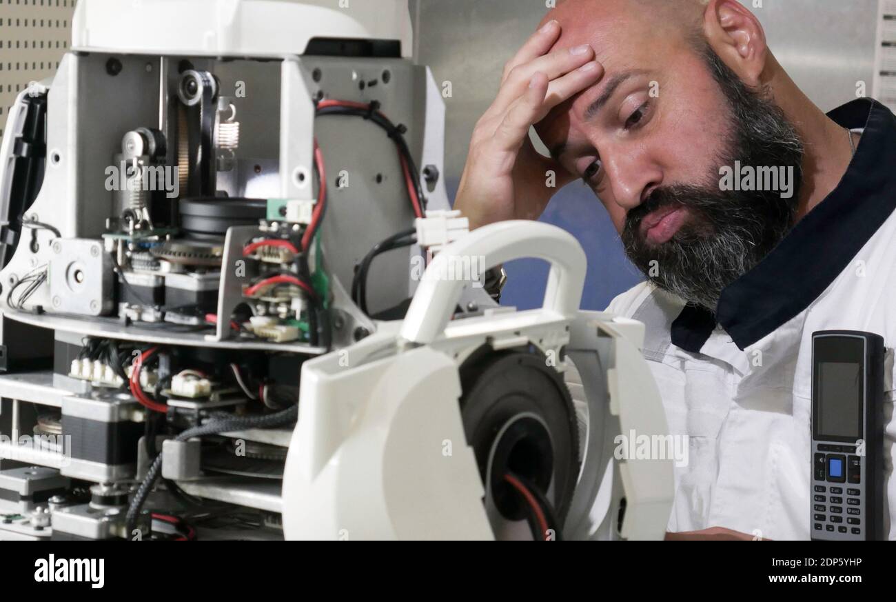 Electronics Engineer has a problem with the machine repair Stock Photo ...