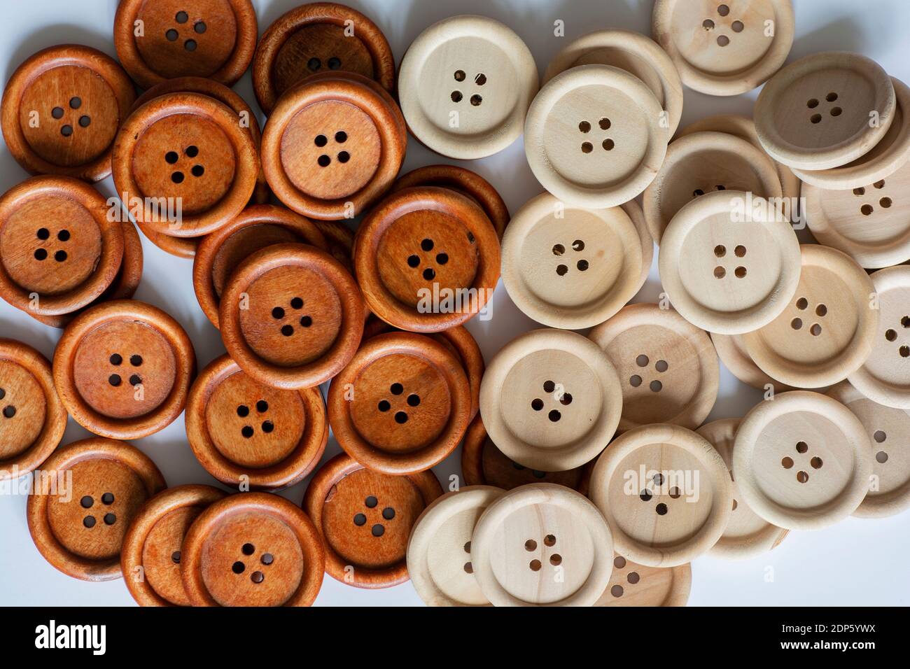 Group of round wooden sewing buttons. Brown and natural wooden sewing ...