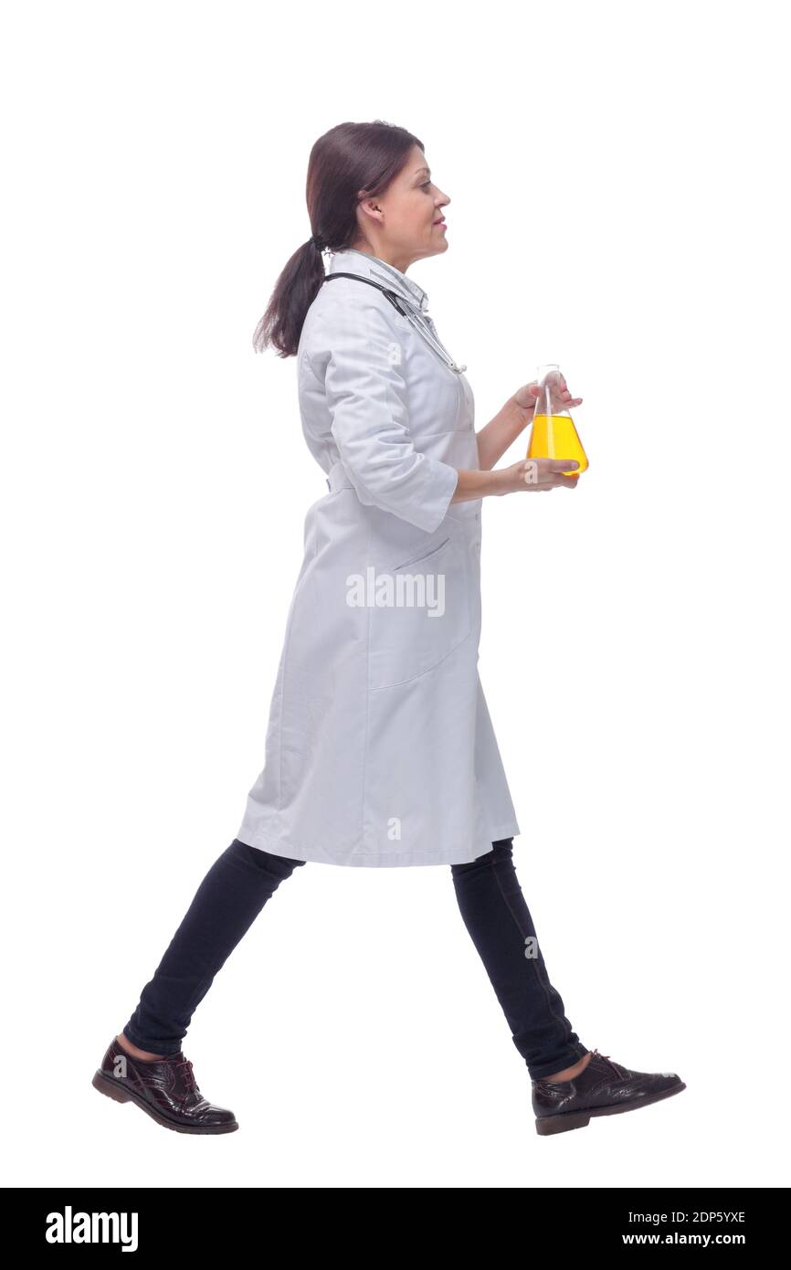 Front view of walking female scientist with beaker Stock Photo - Alamy