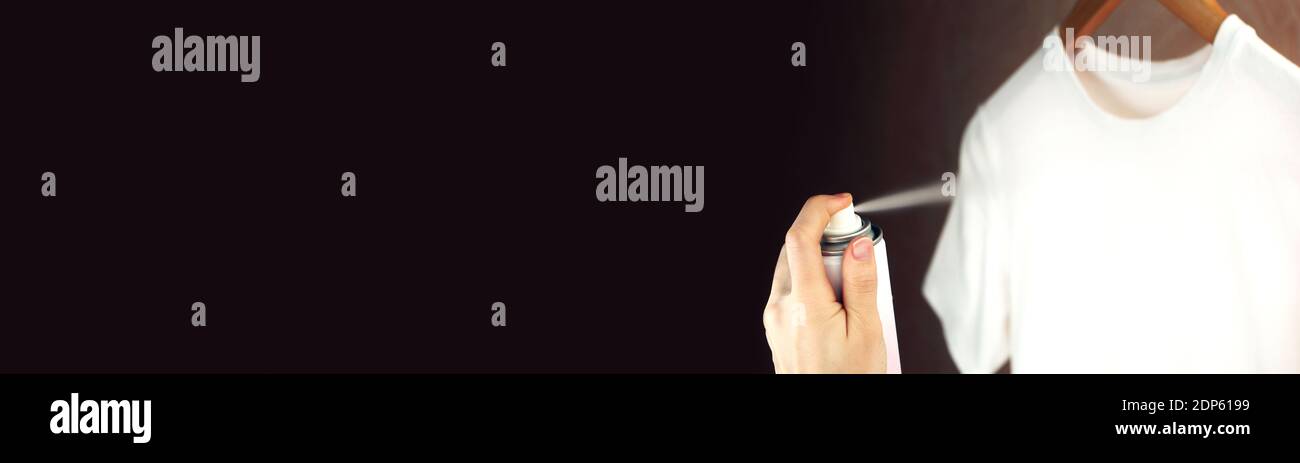 Clothing with static cling banner. White t-shirt on a dark background ...